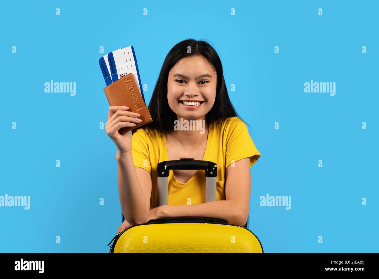 Portrait of smiling young korean lady with down syndrome in yellow t ...