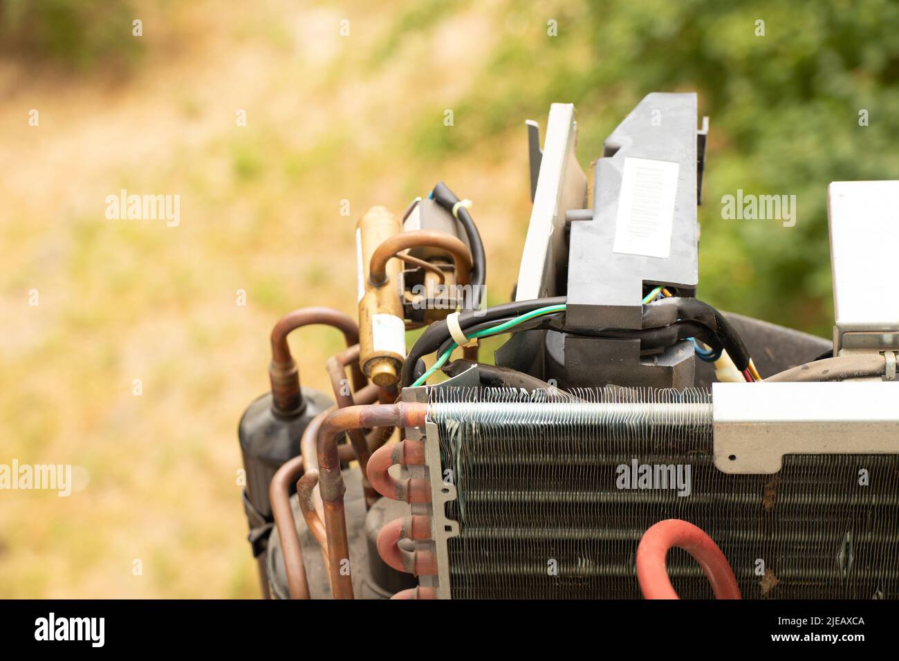 The disassembled outdoor unit of the air conditioner weighs on the ...