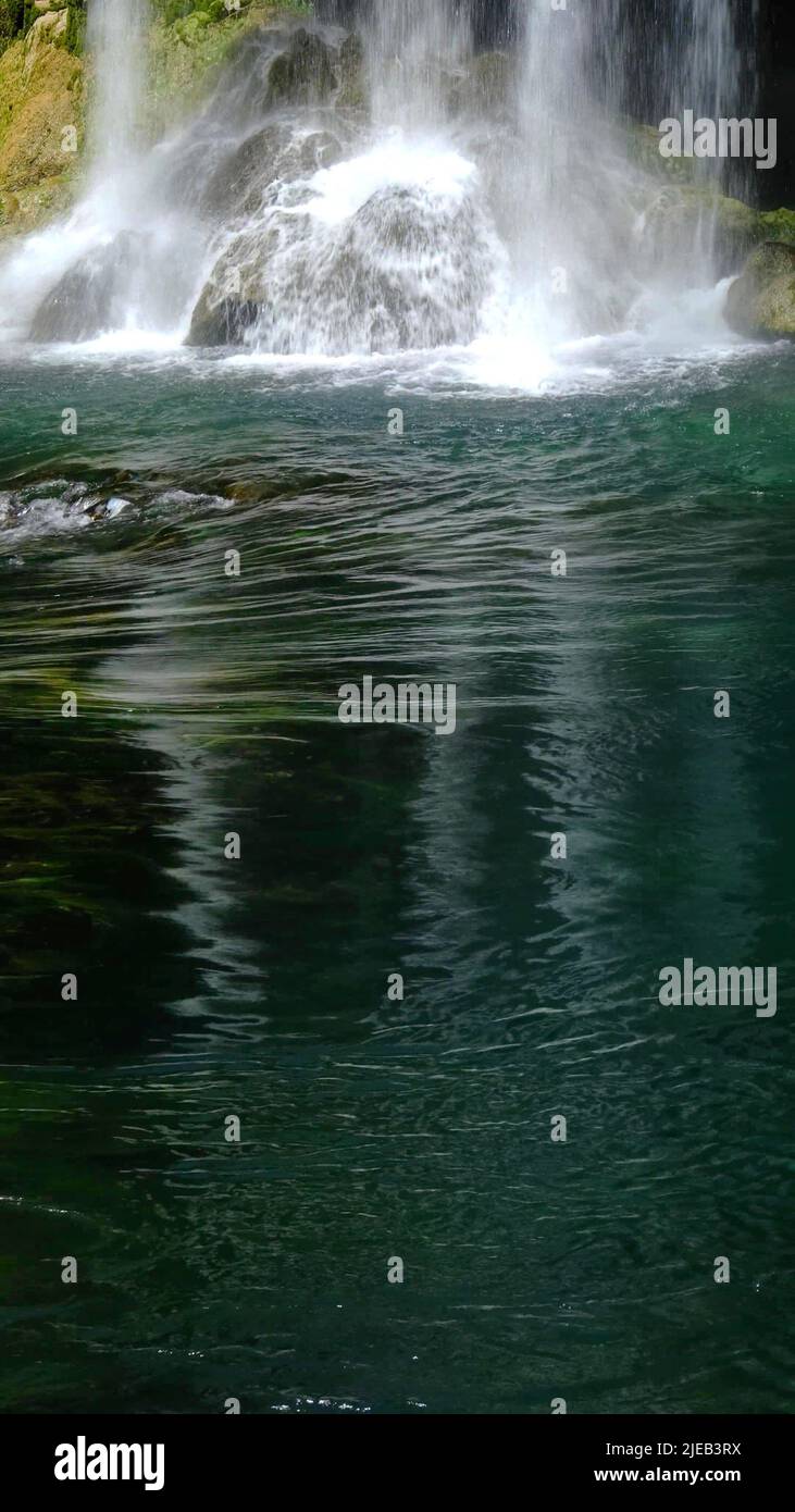 A vertical background photo with a waterfall Stock Photo - Alamy