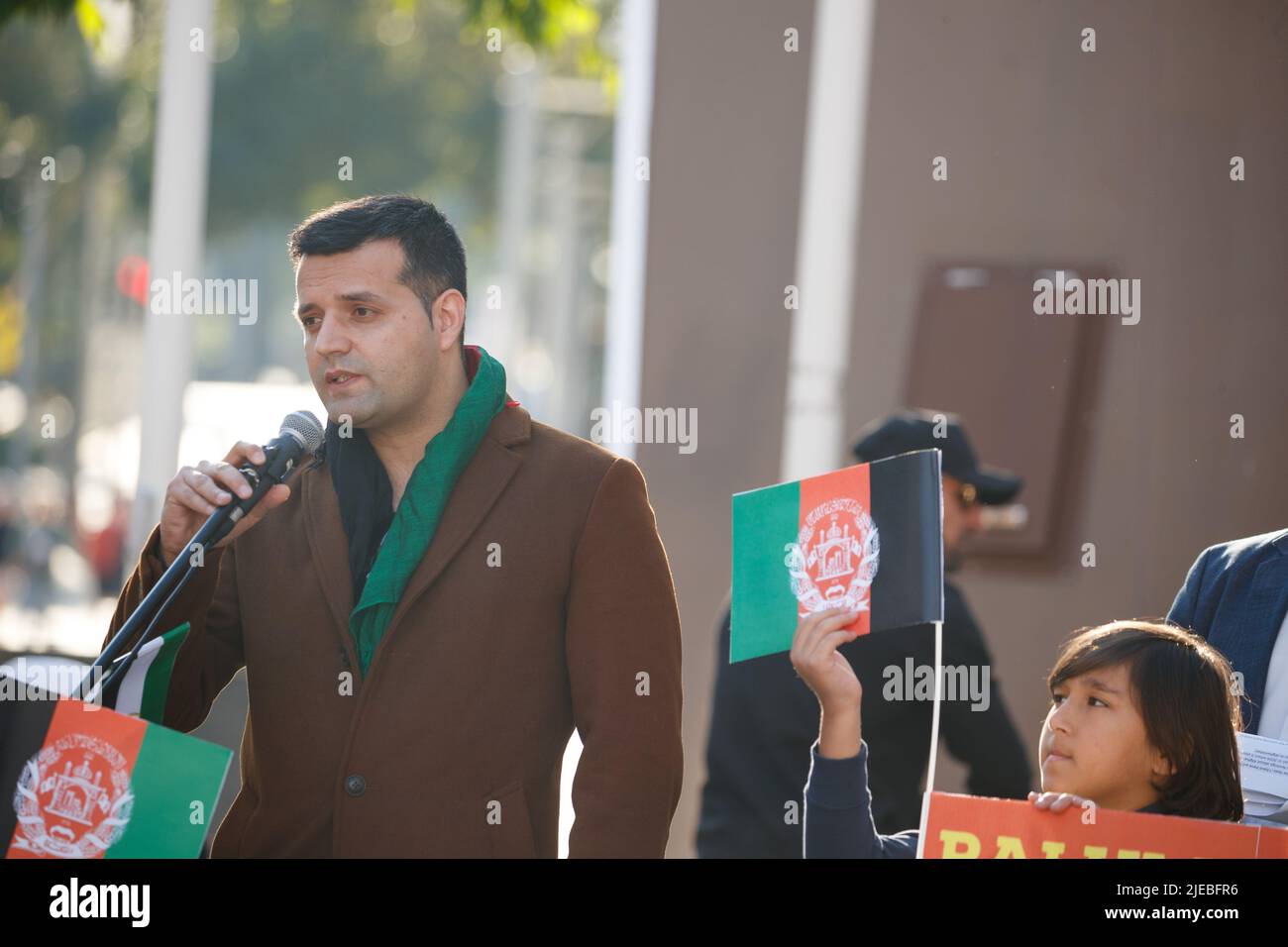 President of the Afghan Community Association Haroon Sadat speaks to ...
