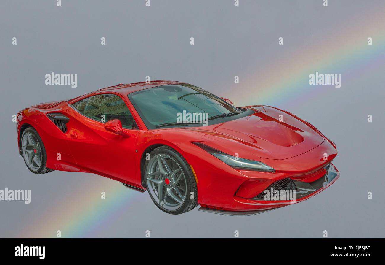 Racing car in bright red against a rainbow with a cooling grill Stock ...