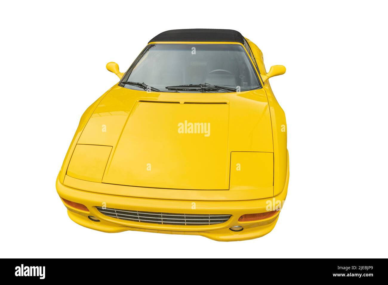 Yellow convertible Ferrari sports car isolate against a white ...