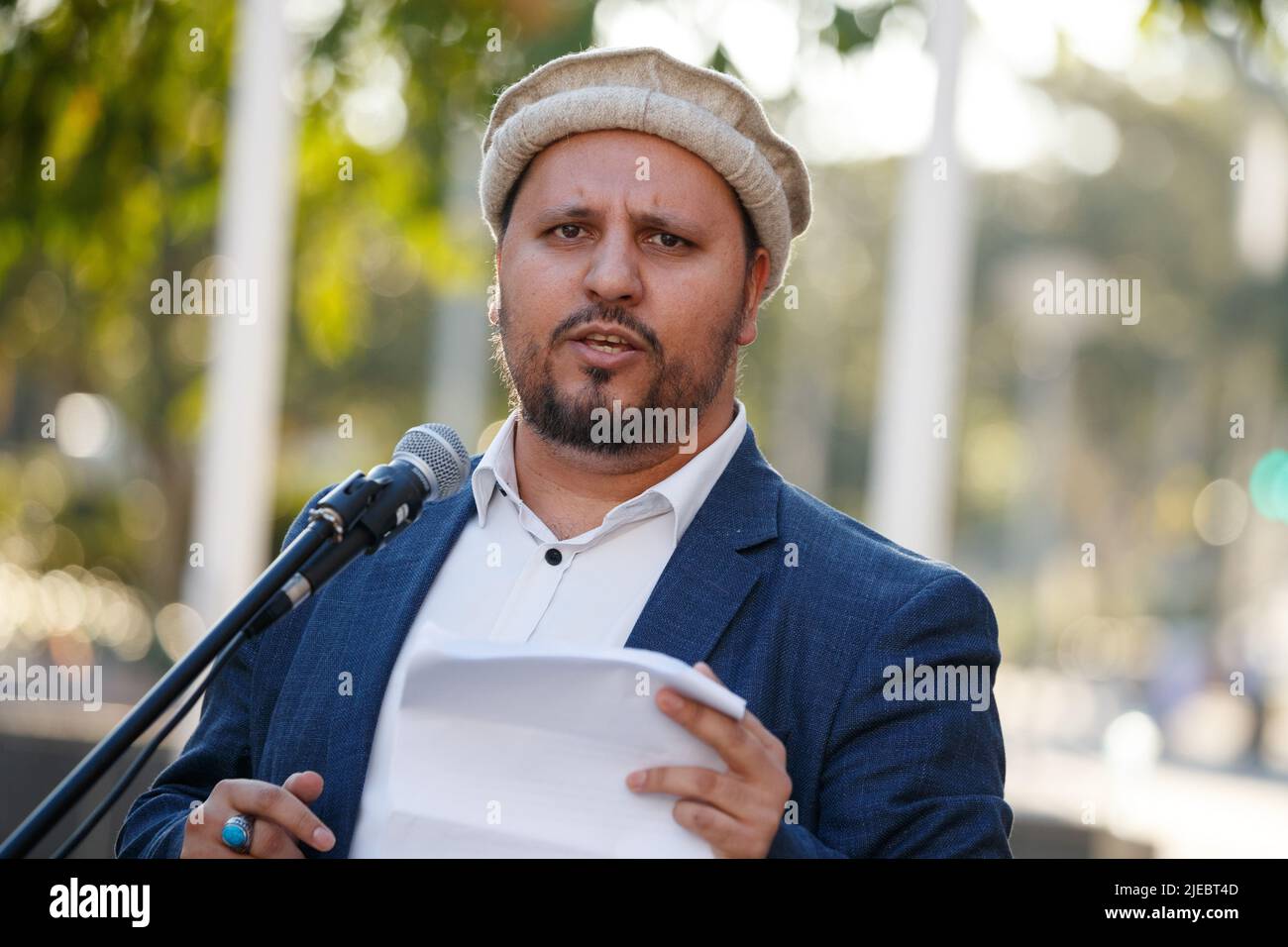 Qld Tajik Community Association representative Waise Ahmad speaks to ...