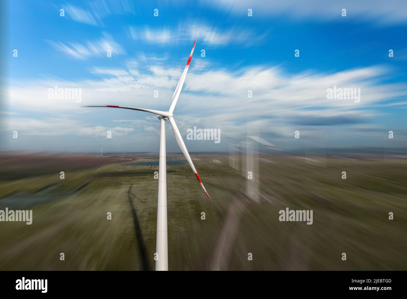Wind Turbines Windmill Energy Farm with blue sky, with motion blur ...