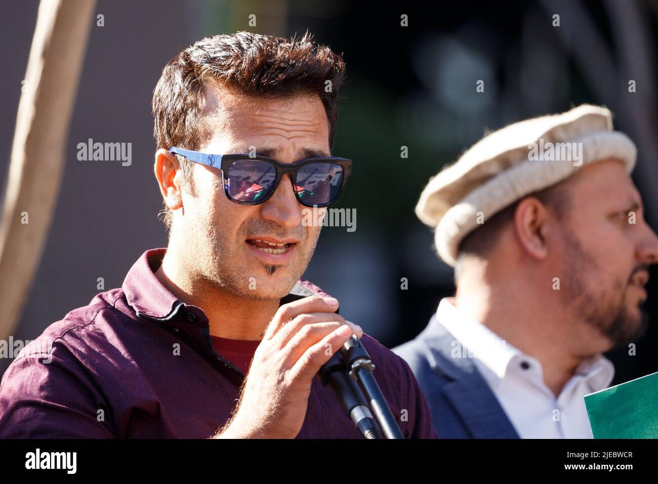 Sayed Yama Ahmadi speaks to colleagues during the rally in King George ...