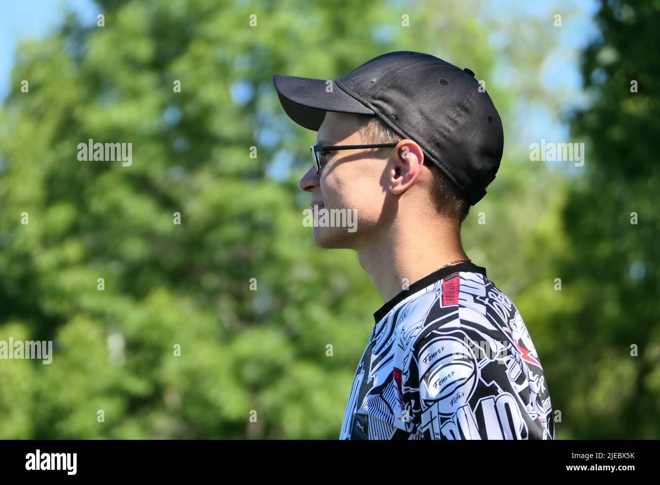 Generation Z. Portrait of a young man of European appearance in glasses ...