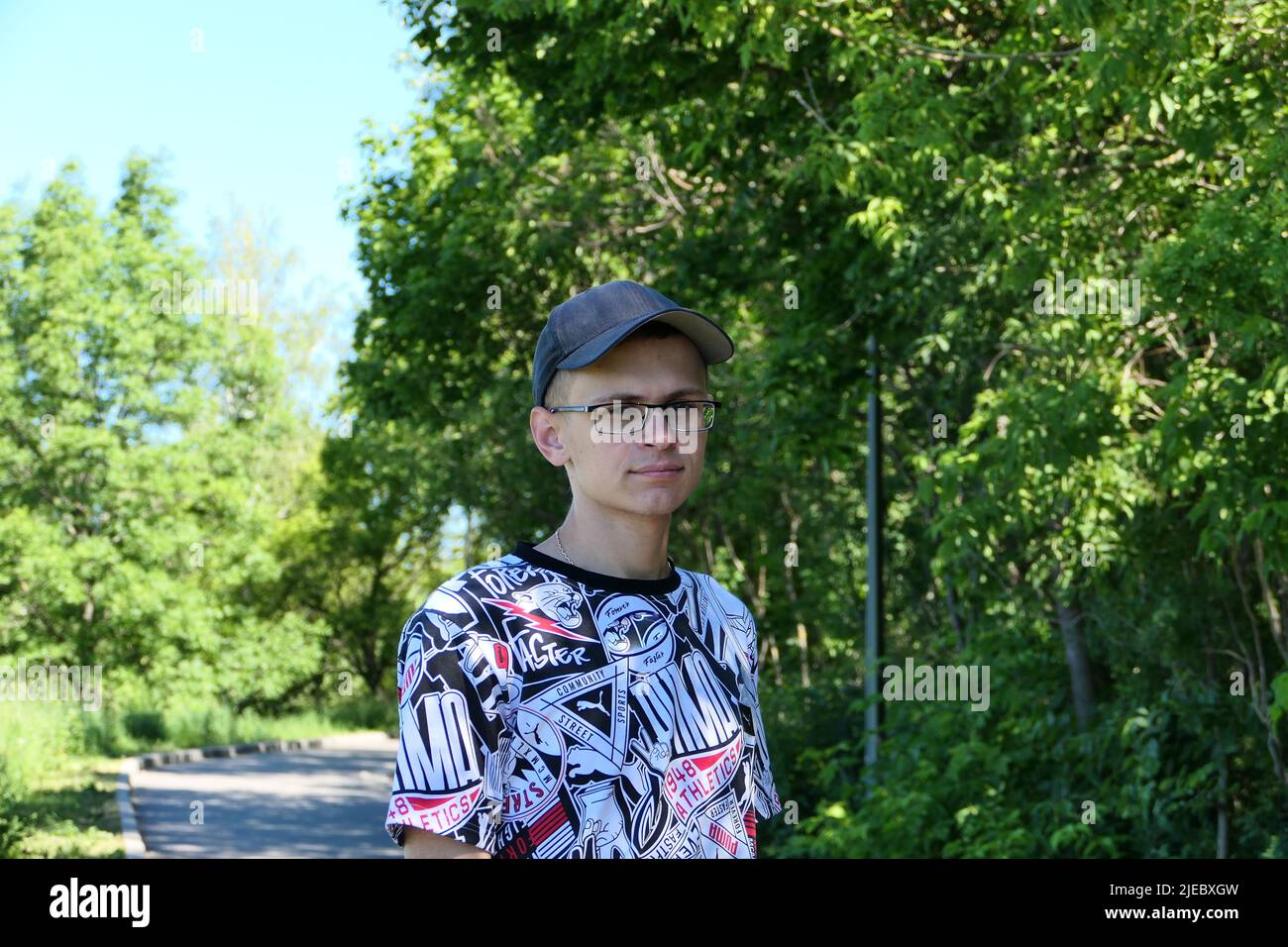 Generation Z. Portrait of a young man of European appearance in glasses ...