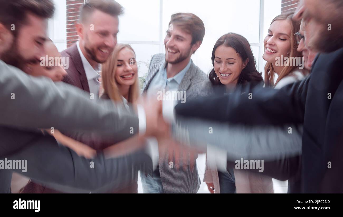 Business people forming hands stack hi-res stock photography and images ...