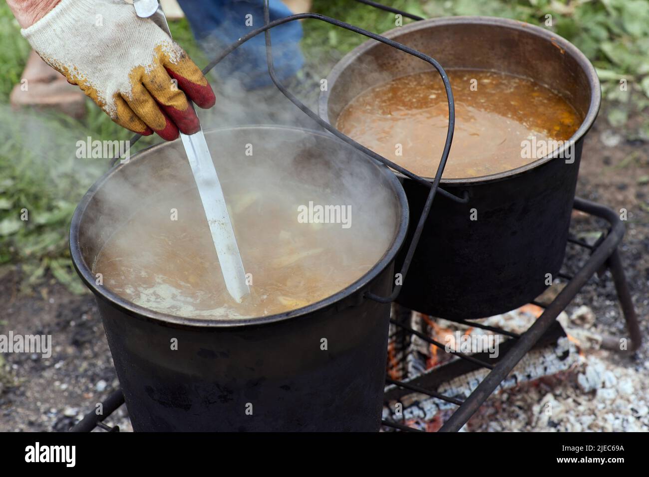 Bowler cooking food bonfire cauldron camp fire, pot. Hiking pot in the ...