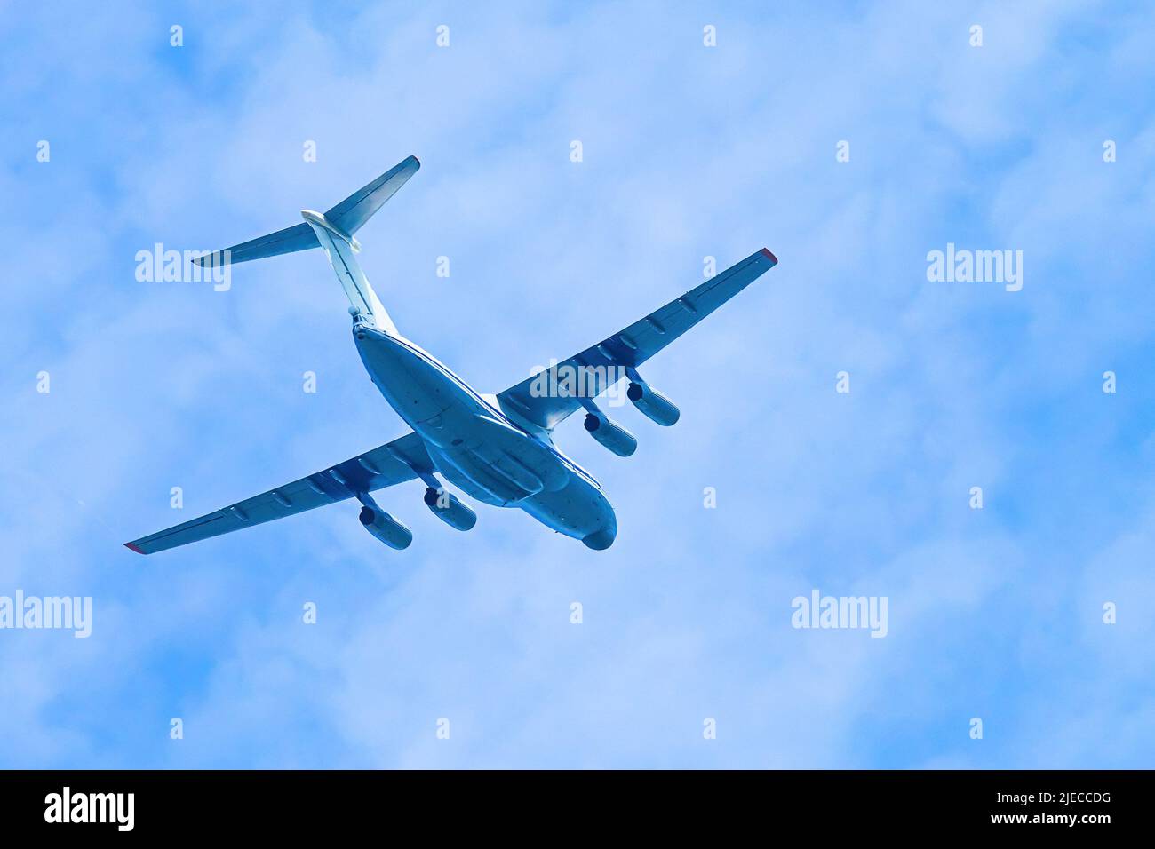 Airplane in blue sky. Air cargo transportation. Plane is flying in the ...