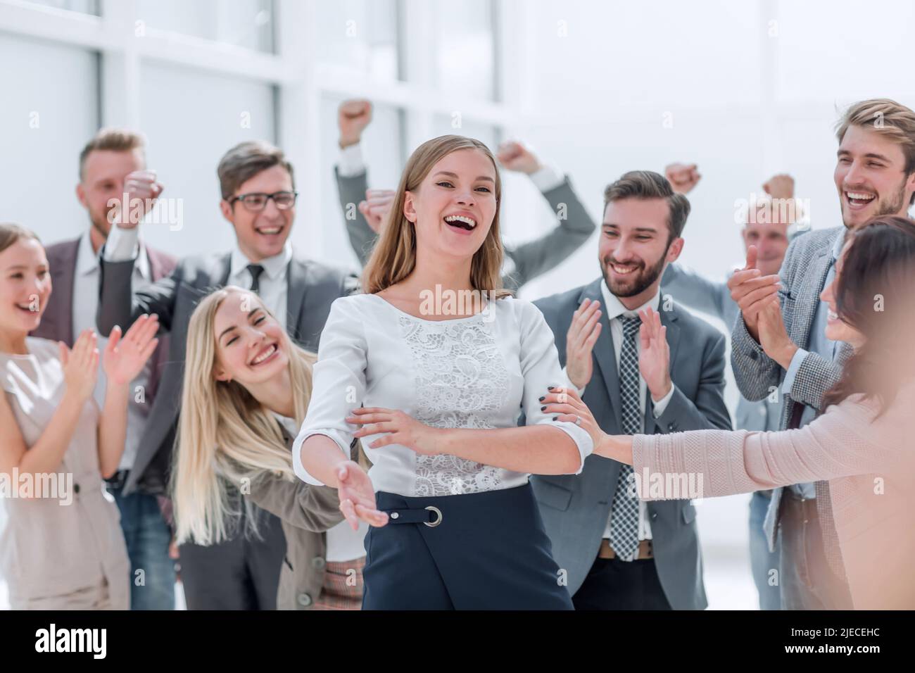 professional business team congratulating their leader. photo with ...