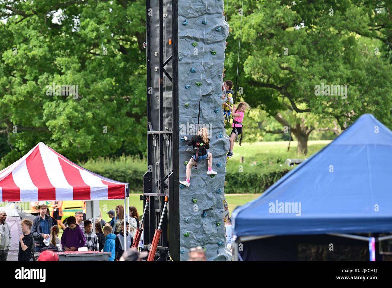 Children take on the wall climb challenge Stock Photo - Alamy