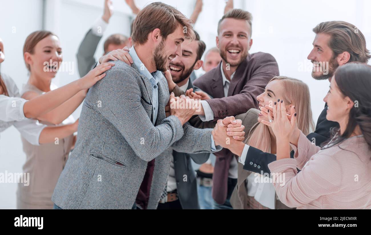 corporate group of employees applauding their colleague Stock Photo - Alamy