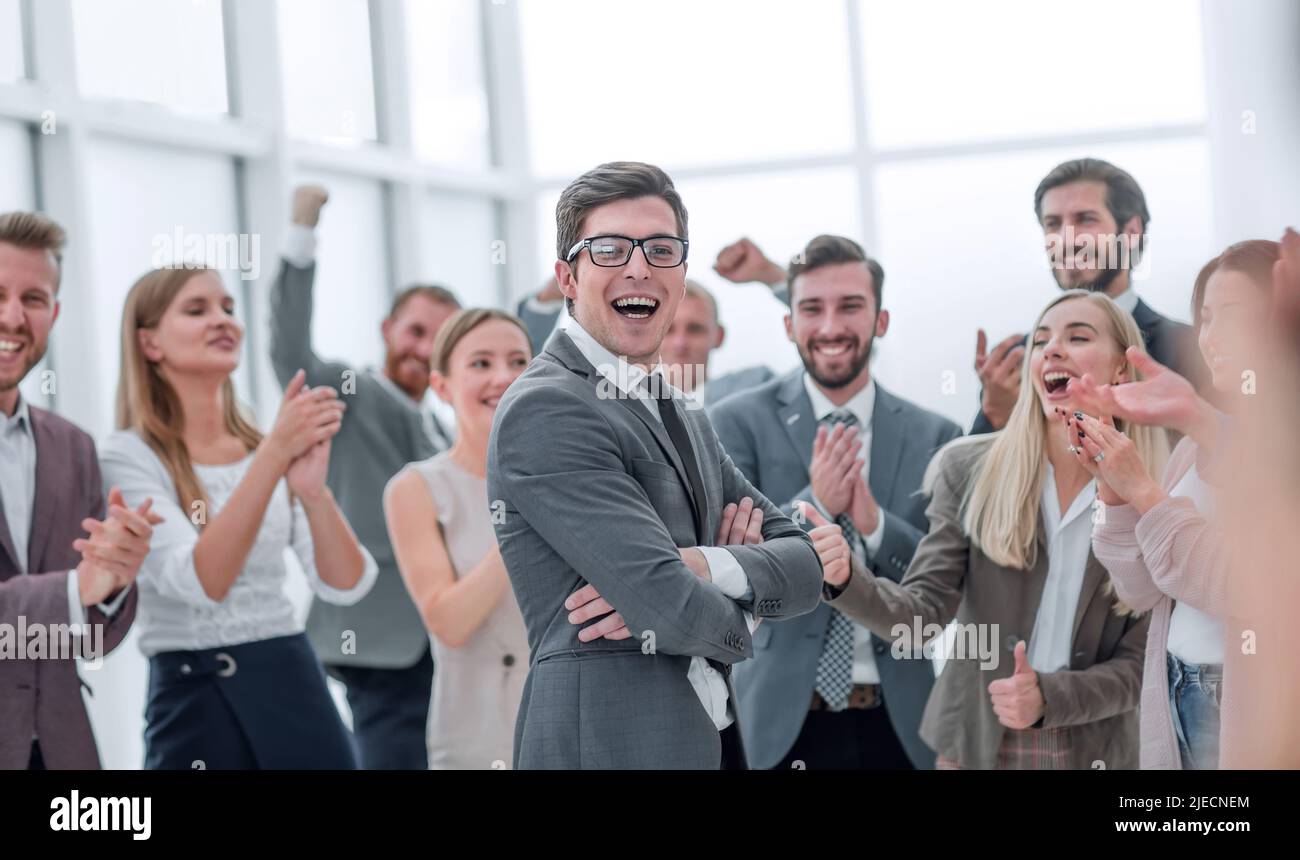 corporate group of employees congratulating each other on the victory ...