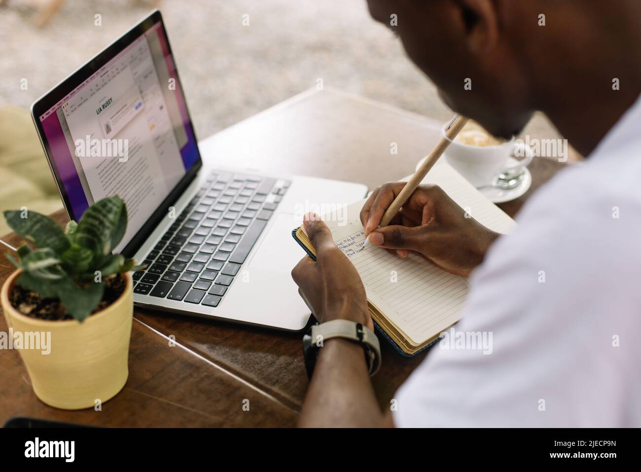 African man writing letter workspace hi-res stock photography and ...