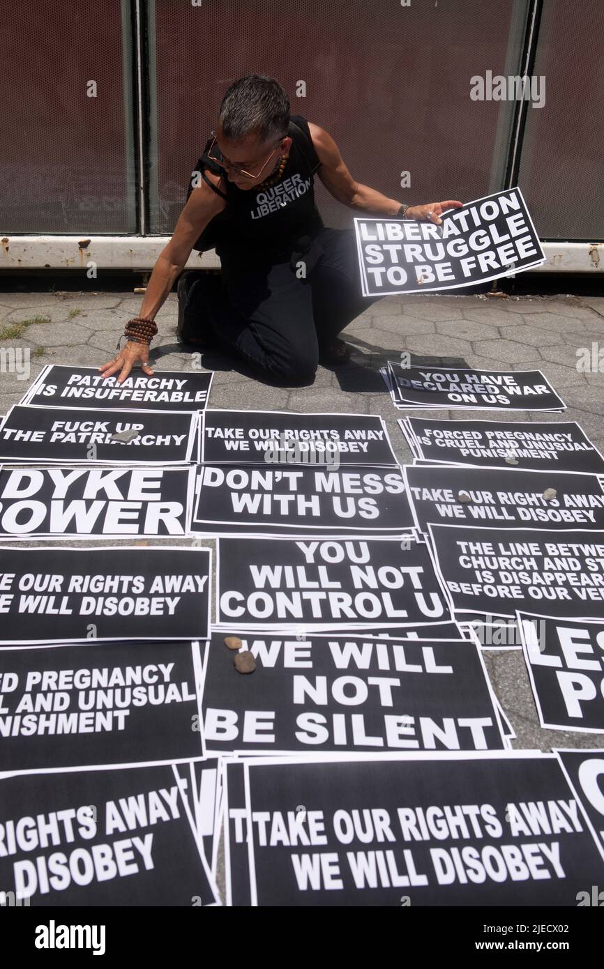 New York City, New York, 26th Jun, 2022-Laurie Arbeiter lines up signs ...