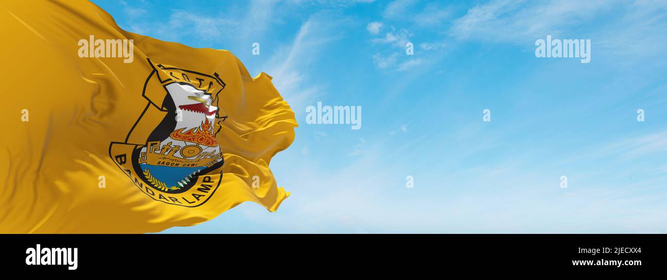 official flag of Bandar Lampung City Indonesia at cloudy sky background ...