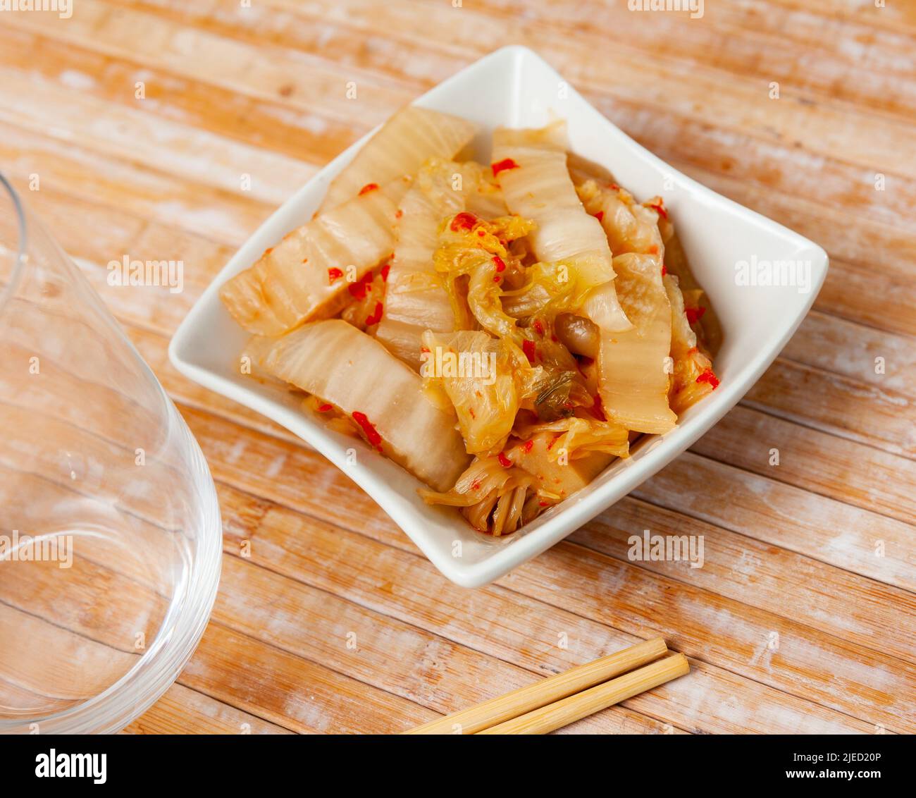 Korean spicy pickled napa cabbage kimchi in salad bowl Stock Photo - Alamy
