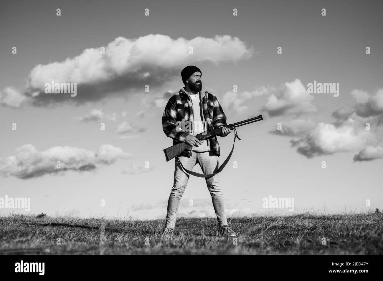 Hunting without borders. Hunter with shotgun gun on hunt. Closed and ...