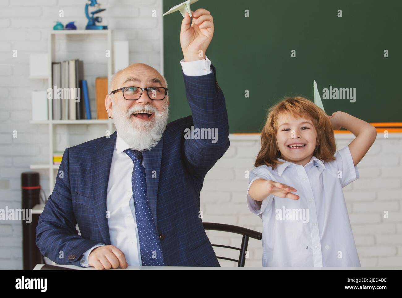 School break with teacher. Pupil with airplanes. Education, teachering ...