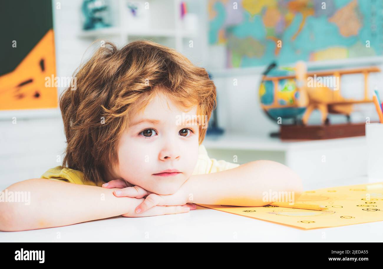 Little children at school lesson. Kid is learning in. Portrait of Pupil ...
