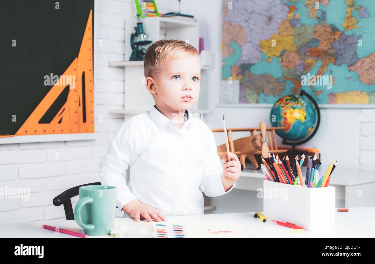 Little 3 year old child at school lesson. Happy cute industrious child ...