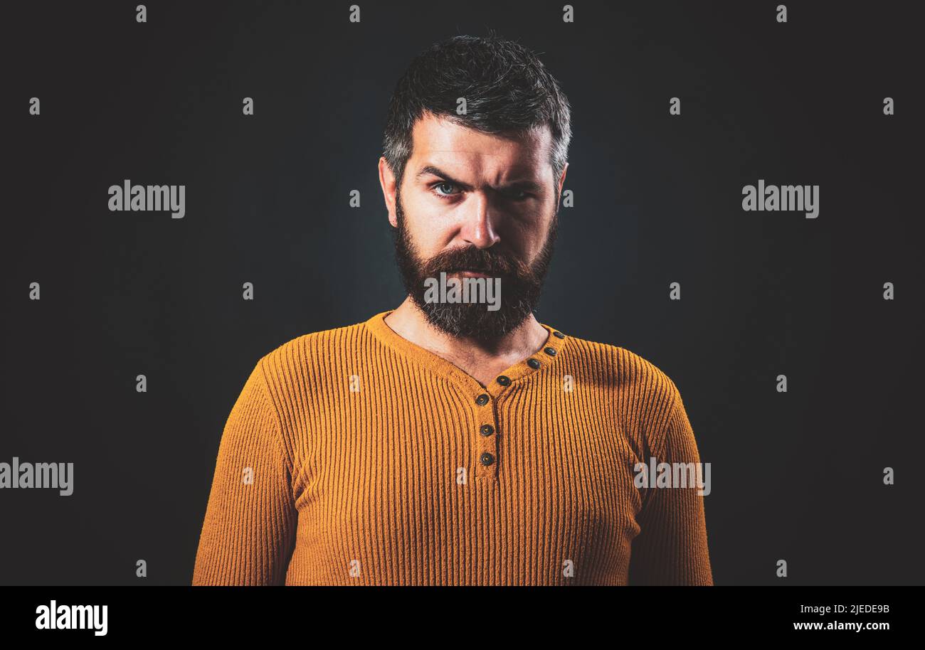 Portrait of confident serious man has beard and mustache on black ...