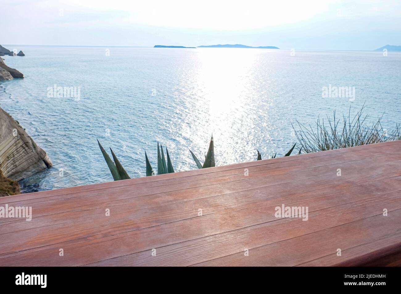 View of empty wooden table at sea resort Stock Photo - Alamy