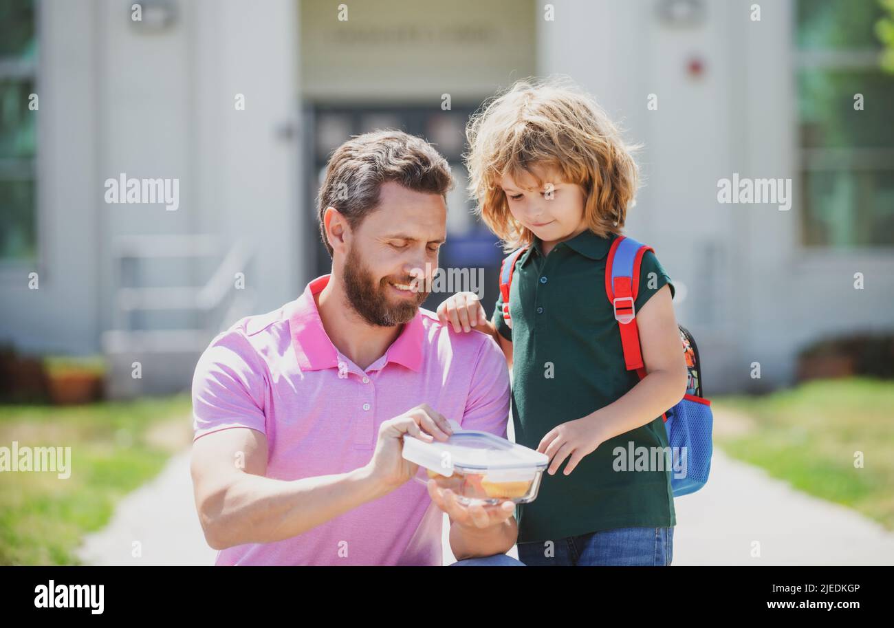 School boy going to school with father. Schoolboy and parent in shirt ...