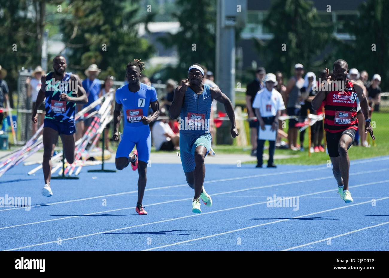 Aaron Brown, centre right, of Toronto, races to a first place finish in ...