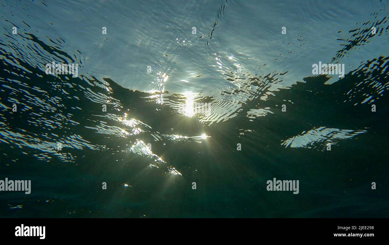 Red Sea, Egypt. 26th June, 2022. Sunrays penetrate through the surface ...