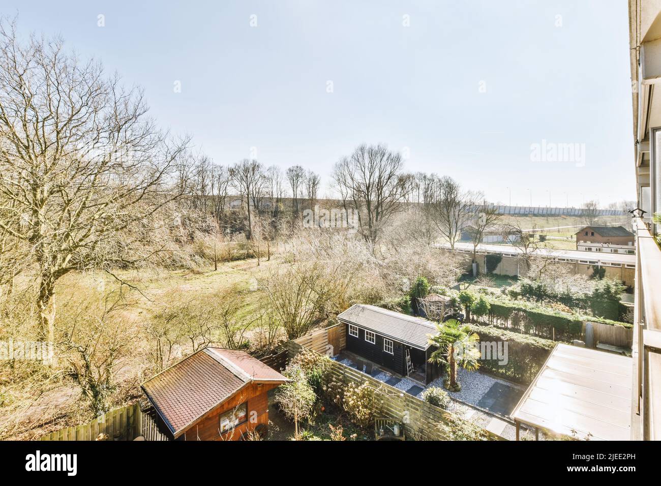 Panoramic view of nature, courtyard with trees and wooden buildings ...
