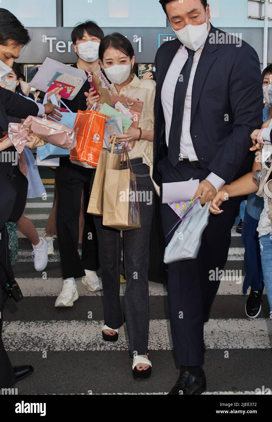 Korean singer and actress IU arrives at Narita International airport in ...