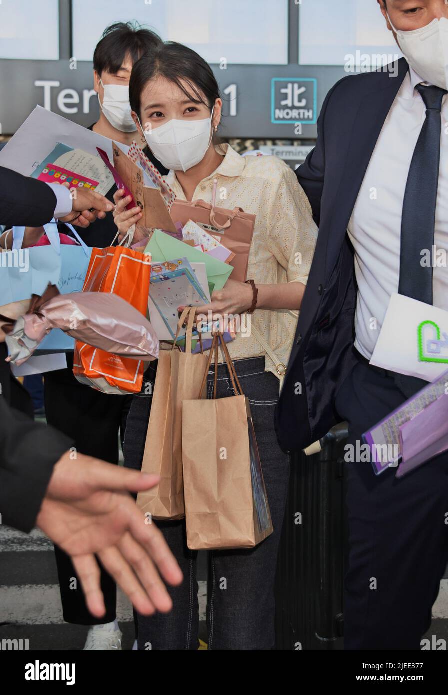 Korean singer and actress IU arrives at Narita International airport in ...