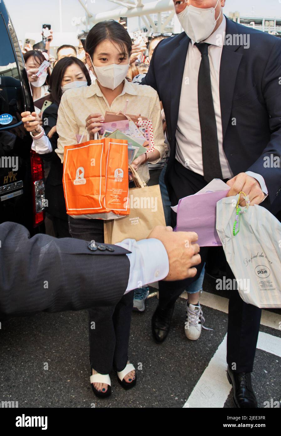 Korean singer and actress IU arrives at Narita International airport in ...