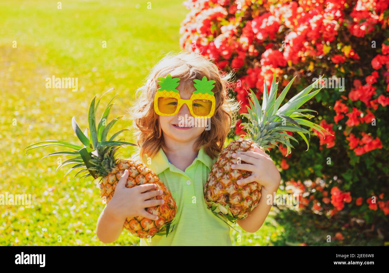 Funny boy with pineapple, close up kids face Stock Photo - Alamy