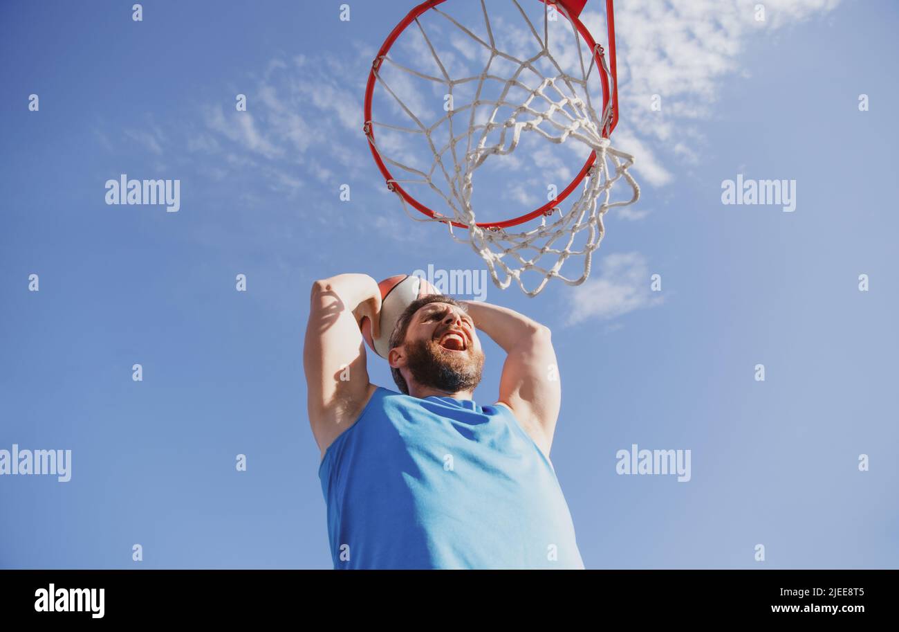 Caucasian basketball player of team in action, motion in jump on sky ...