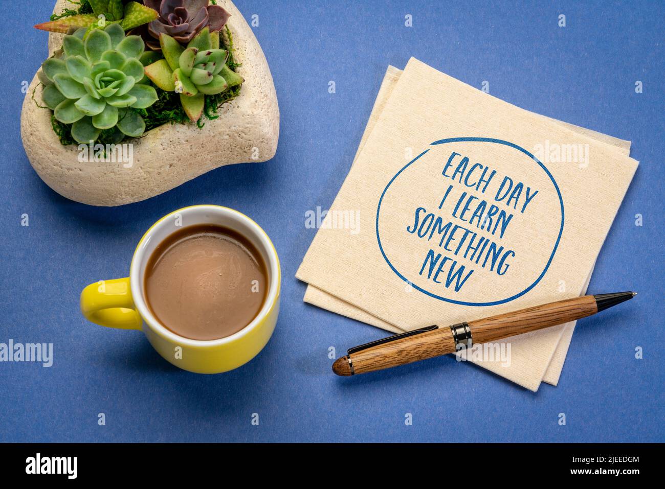 Each day I learn something new - positive words on a napkin with coffee ...