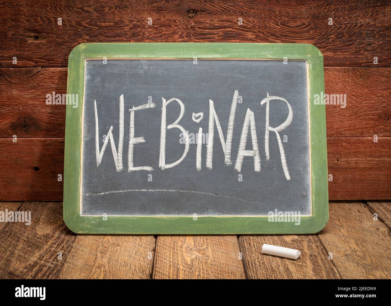 webinar word in white chalk handwriting on a vintage slate blackboard ...