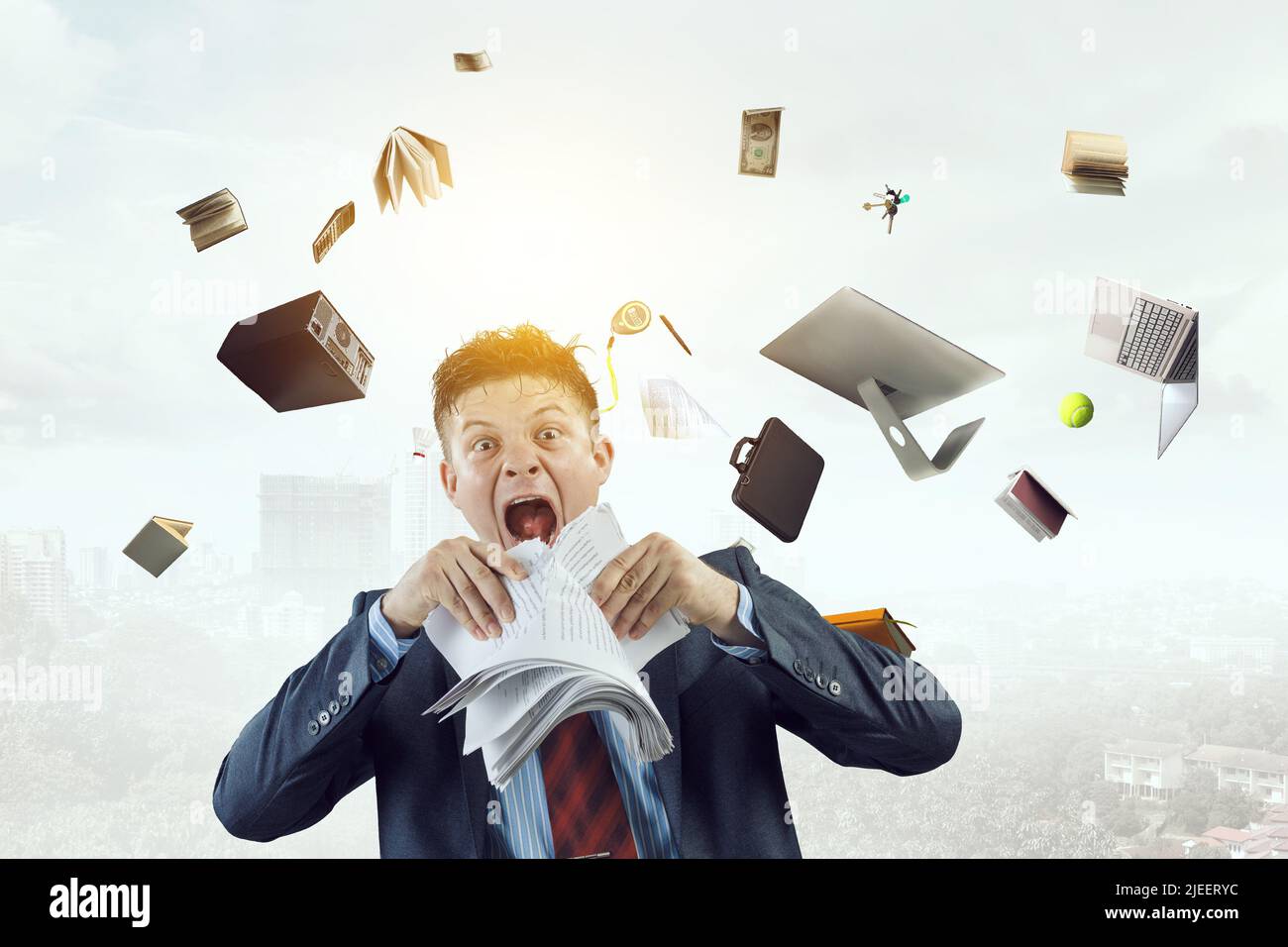 Young stressed man ripping documents with frustrated facial expression Stock Photo - Alamy