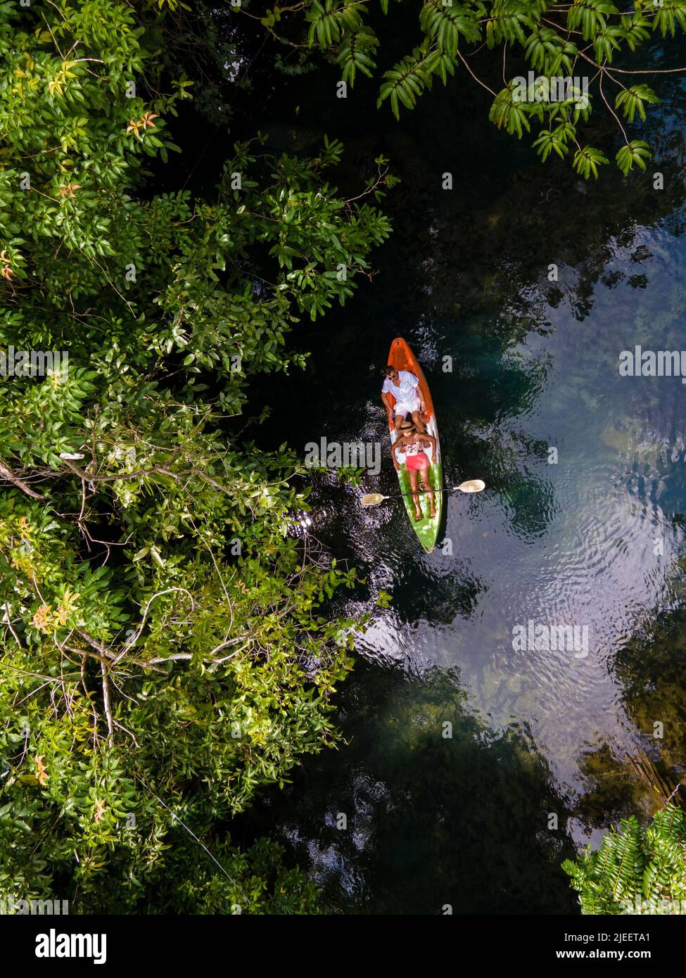 couple in a kayak in the jungle of Krabi Thailand, men and woman in ...