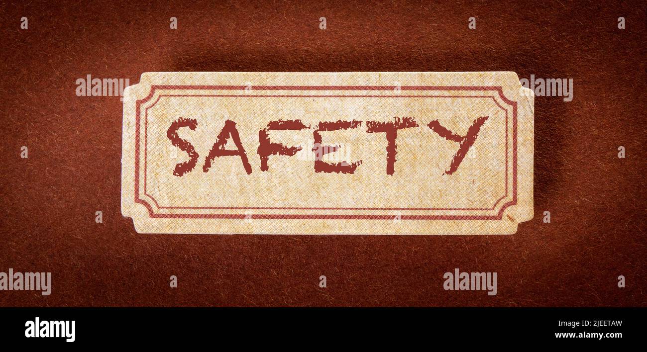 SAFETY. Text on cardboard and brown textured background Stock Photo - Alamy