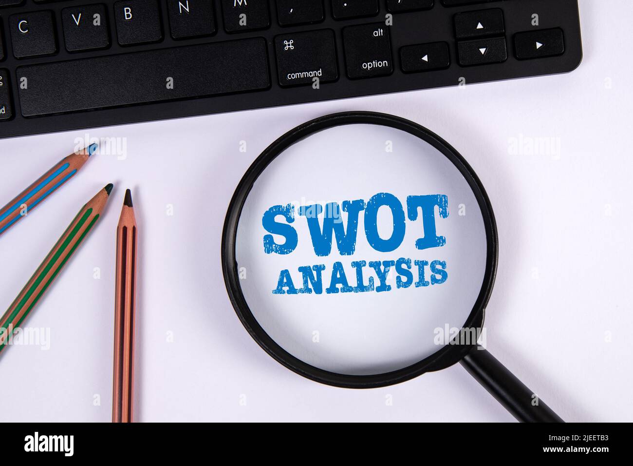 SWOT ANALYSIS. Search and research concept. Magnifying glass on office ...