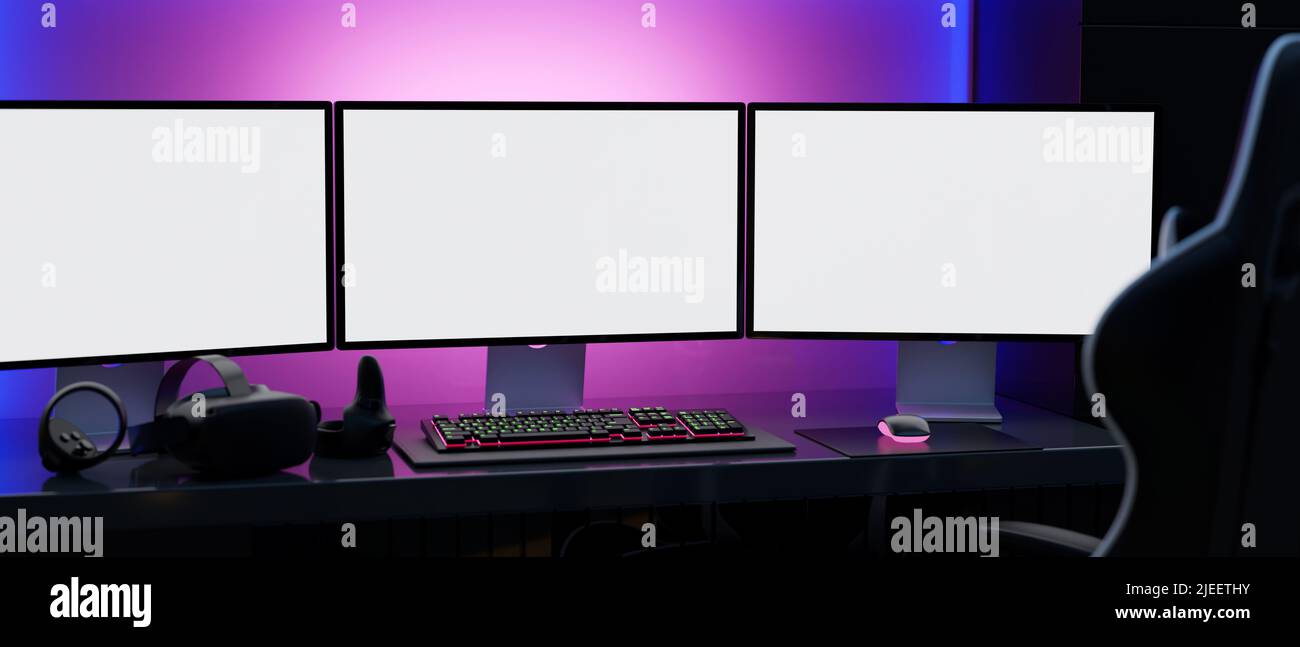 Modern gamer computer desk setup with RGB lights on the background ...