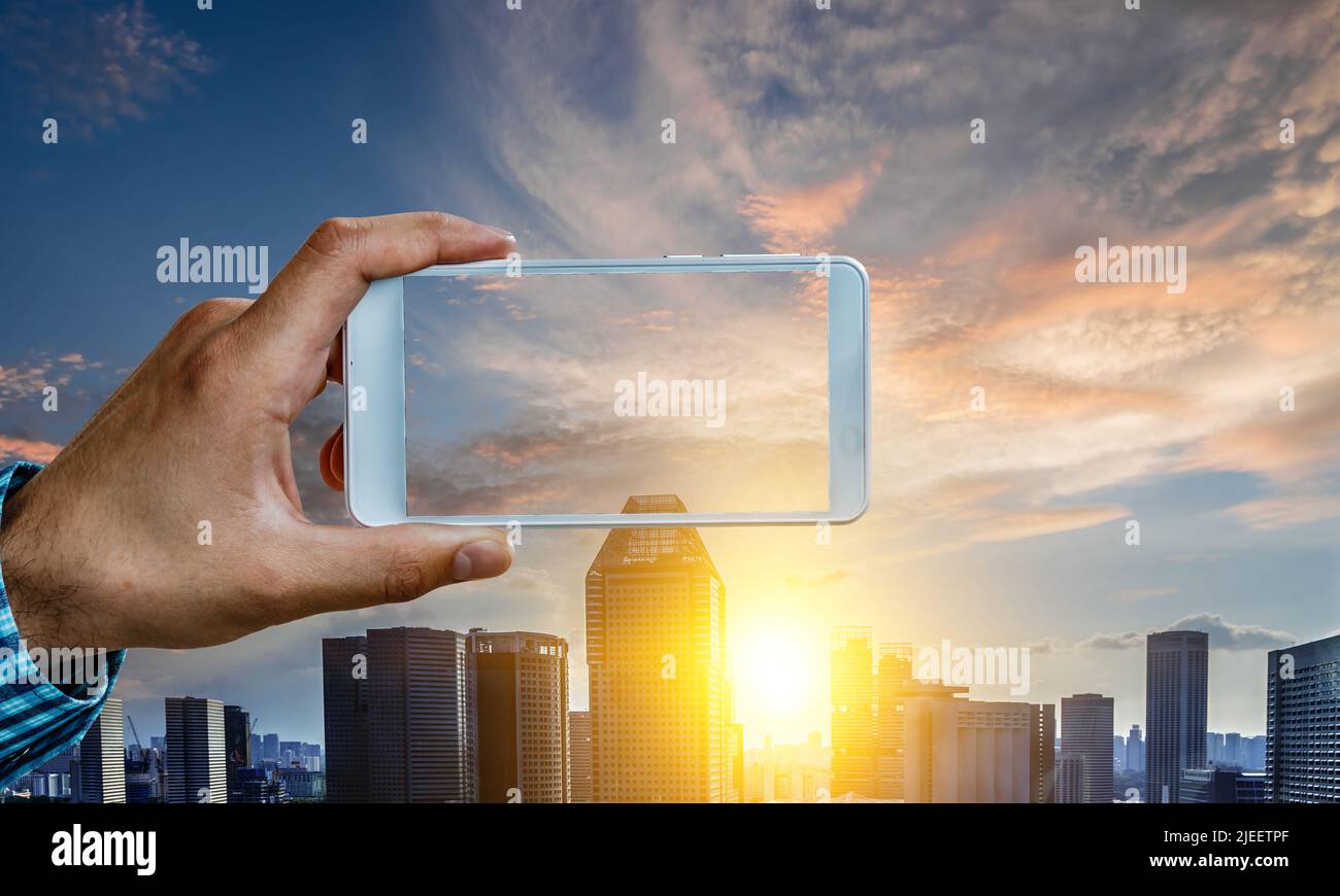 Hand holding smartphone mobile . Mixed media Stock Photo - Alamy