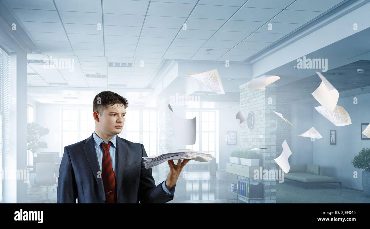 Business Concept - handsome young professional businessman holding ...