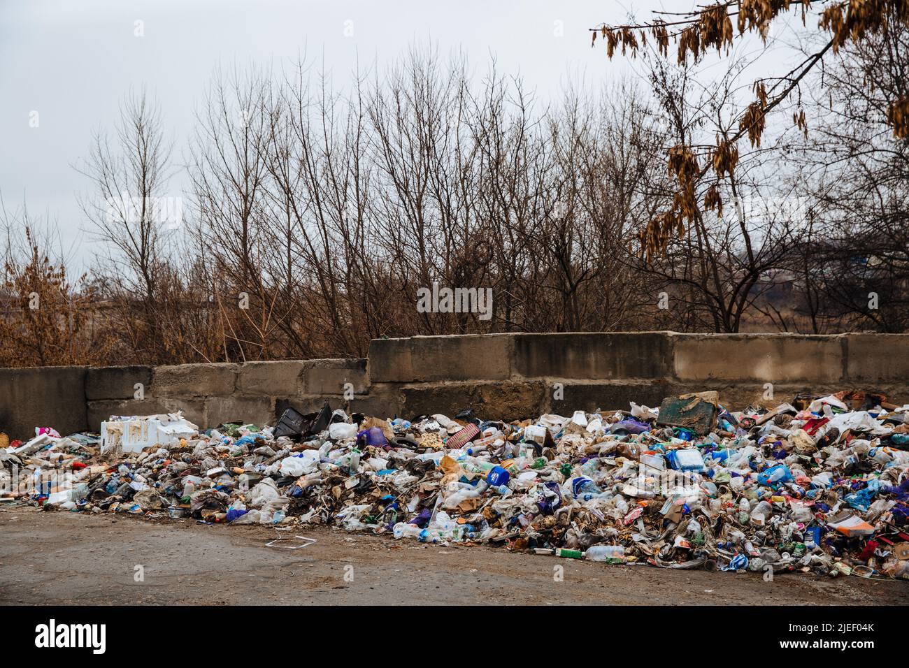 Dneprorudnoe, Ukraine - January 29 2020:Garbage dump on the grass near ...