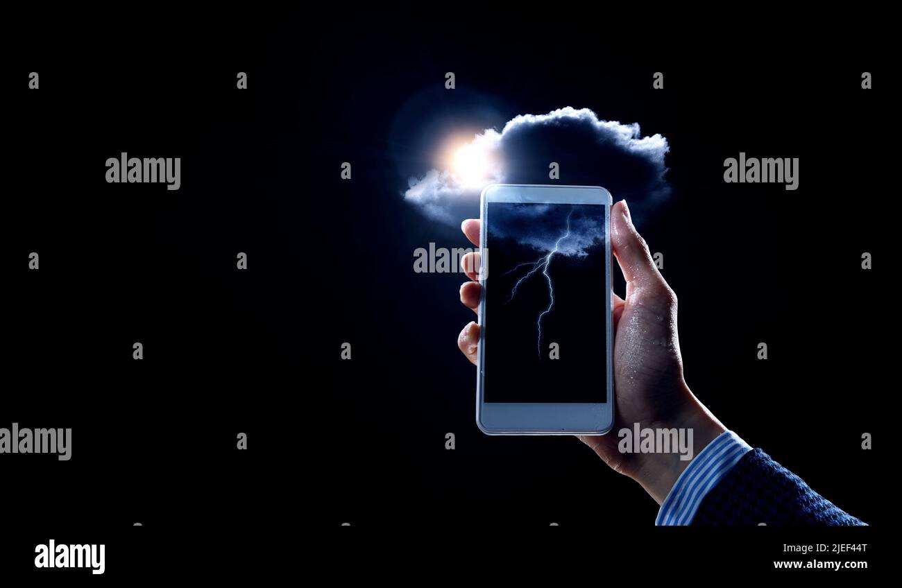 Thunderstorm with lightning on mobile phone screen Stock Photo - Alamy