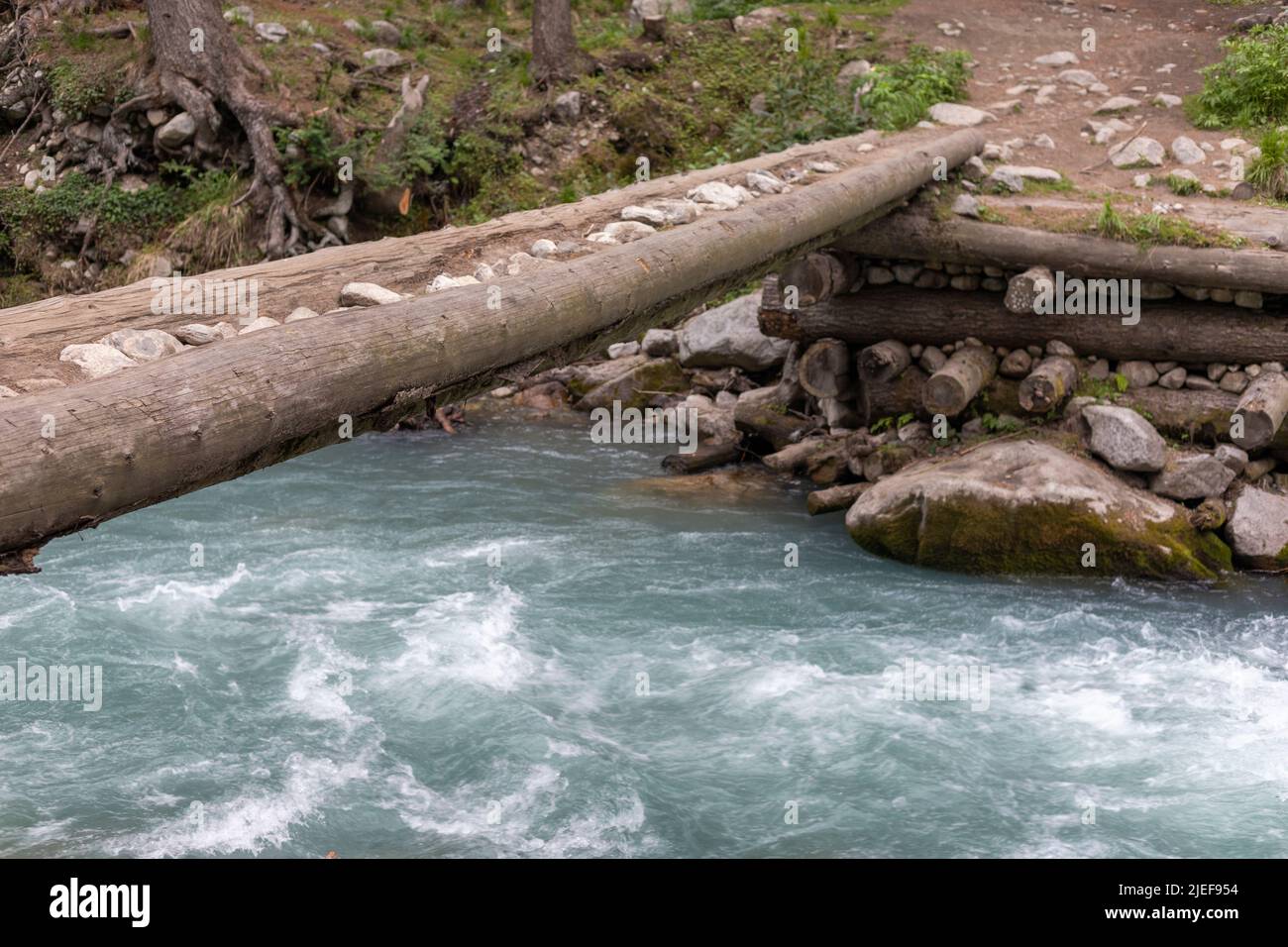 Tree trunk bridge over a river in Kumrat, Pakistan Stock Photo - Alamy