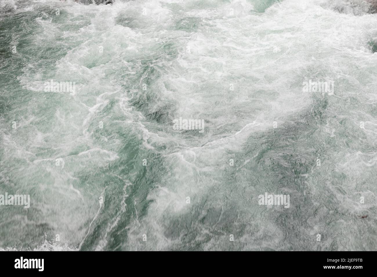 Swirling foam in blue water hi-res stock photography and images - Alamy